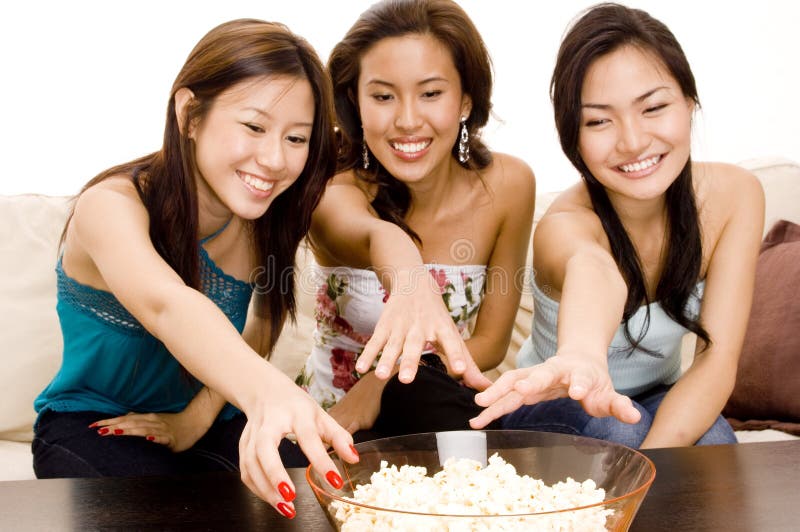 Reaching for Popcorn stock image. Image of group, hair - 423229
