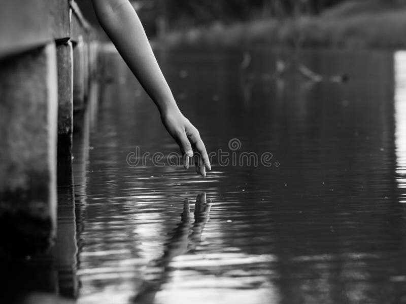 Hand Reaching Water Stock Photos - Download 573 Royalty Free Photos