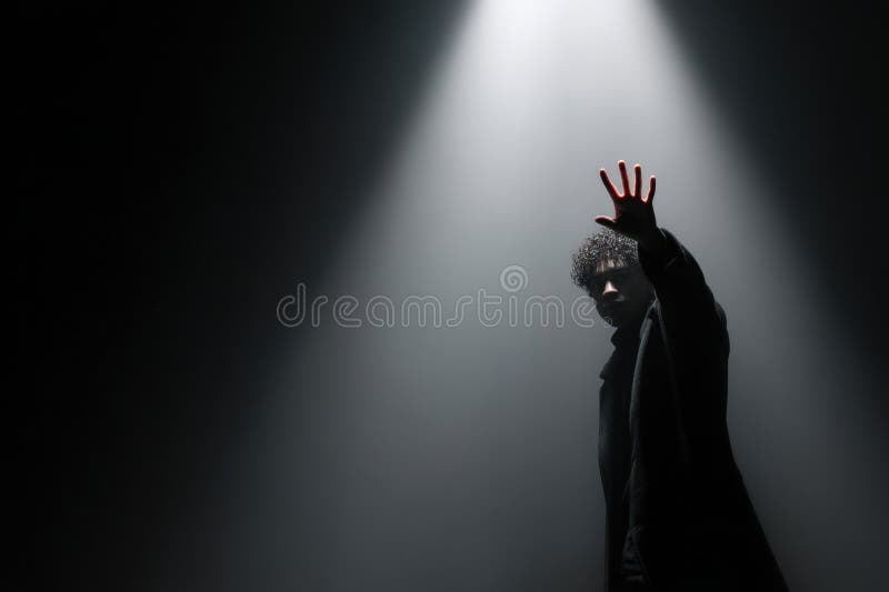 Reaching for the Shadow on Stage during a Captivating Performance Stock ...