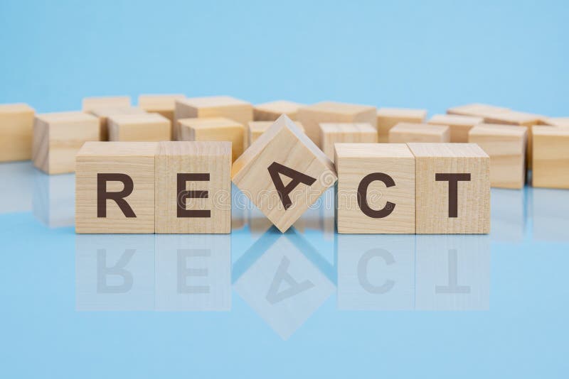 React - Text of on Wooden Cubes, Reflected from the Bright Blue Surface ...