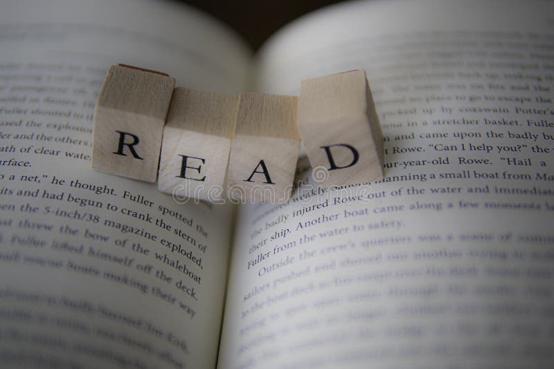 Read in Block Letter on an Open Book Stock Image - Image of wood ...