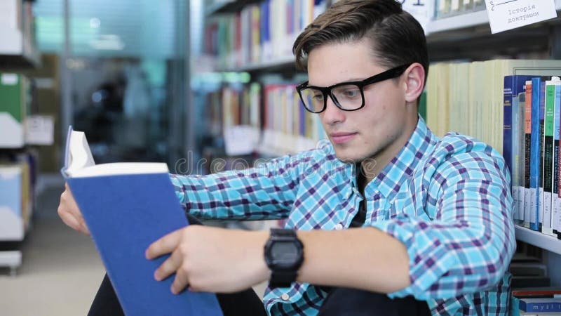 Read Book. Student at Library Reading Book, Learning Stock Video ...