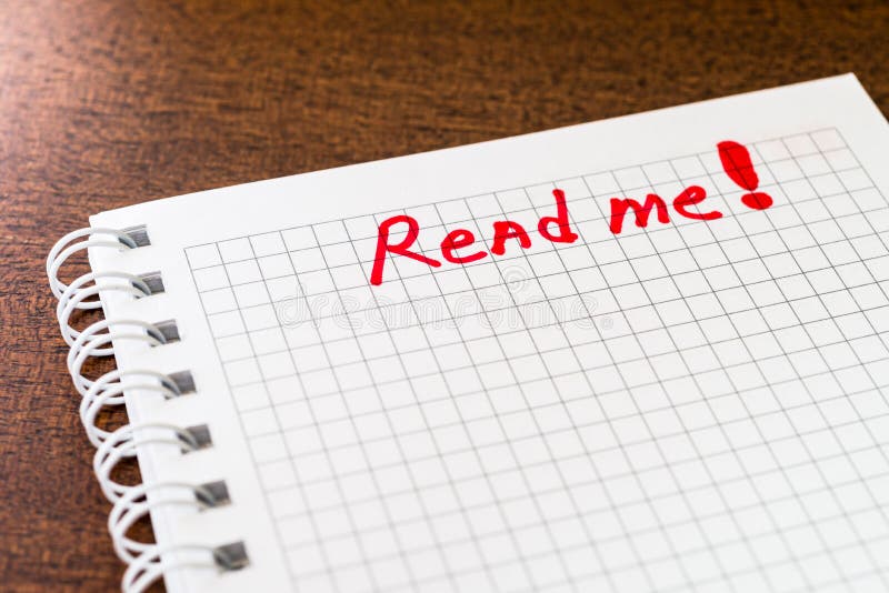 Read Me Sign in the Notebook by Red Marker in the Hand Stock Image ...