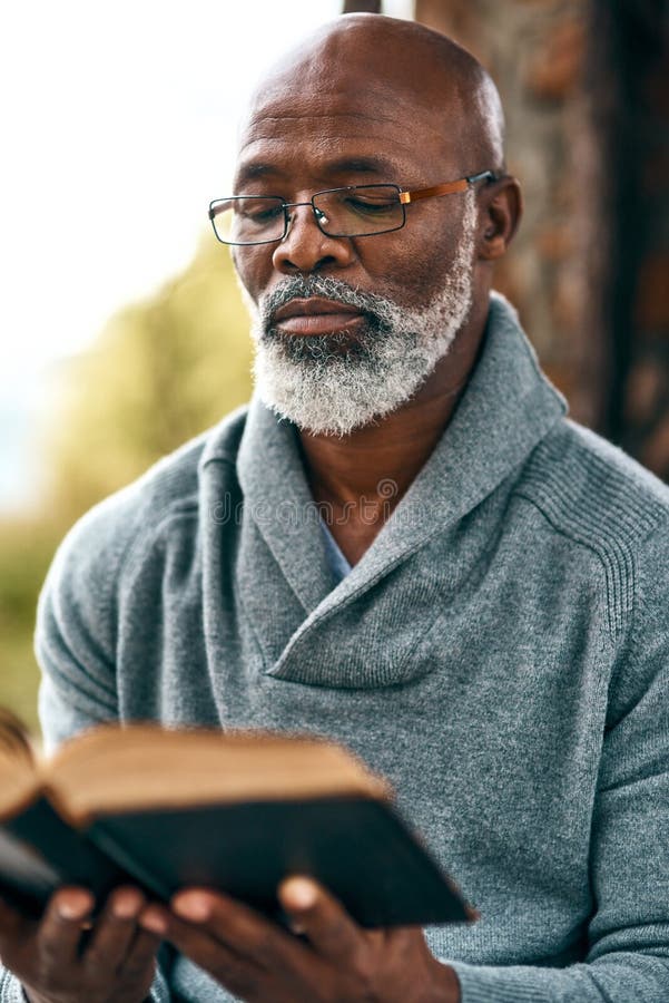 Read More, Worry less. a Man Reading a Book Outside. Stock Photo ...