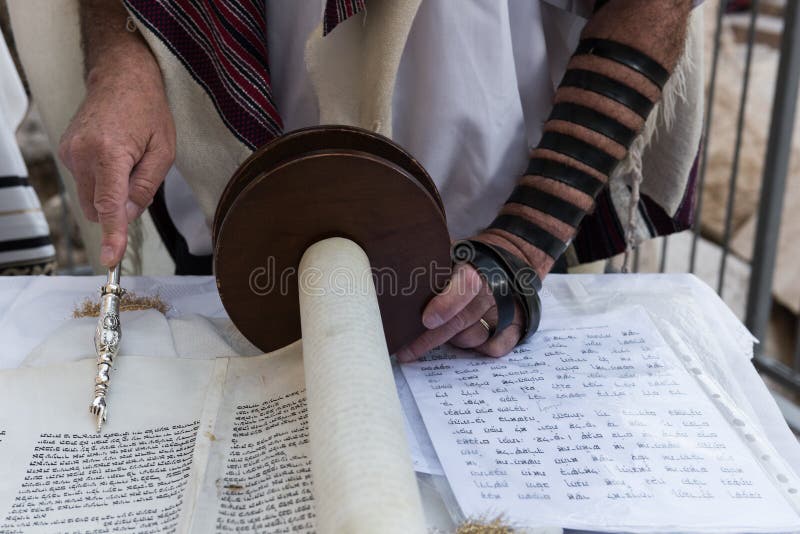 A Reader of the Torah Uses a Yad or Pointer As a Guide Stock Photo ...