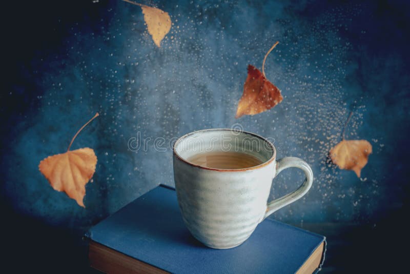 Reading in Autumn, a Still Life with a Cup of Tea, Falling Leaves and ...