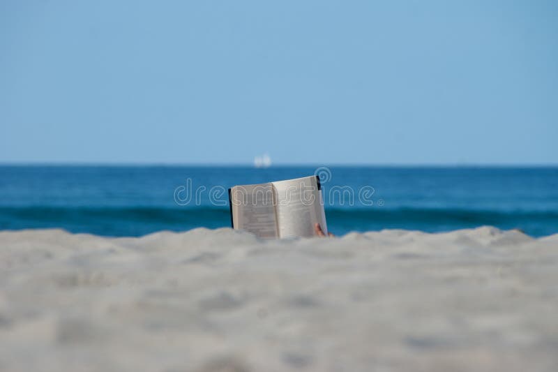 Reading in the beach stock photo. Image of sand, relax - 91264528