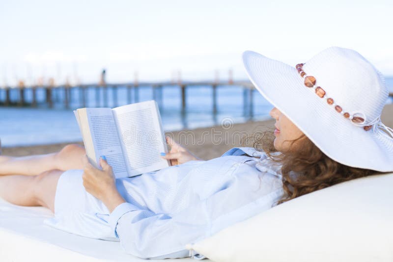 Reading on Beach stock photo. Image of destinations - 151518574