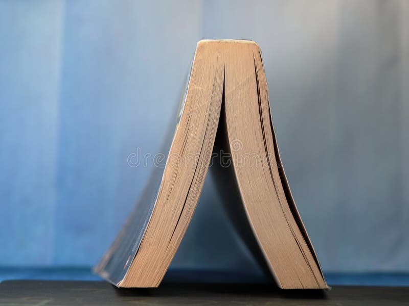 A Reading Book on Blue Background Stock Image - Image of ancient ...