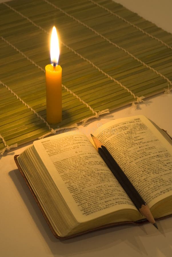 Reading book with candle stock image. Image of faith - 21324949