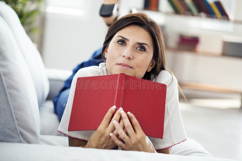 Reading book on home stock image. Image of book, middle - 101003077