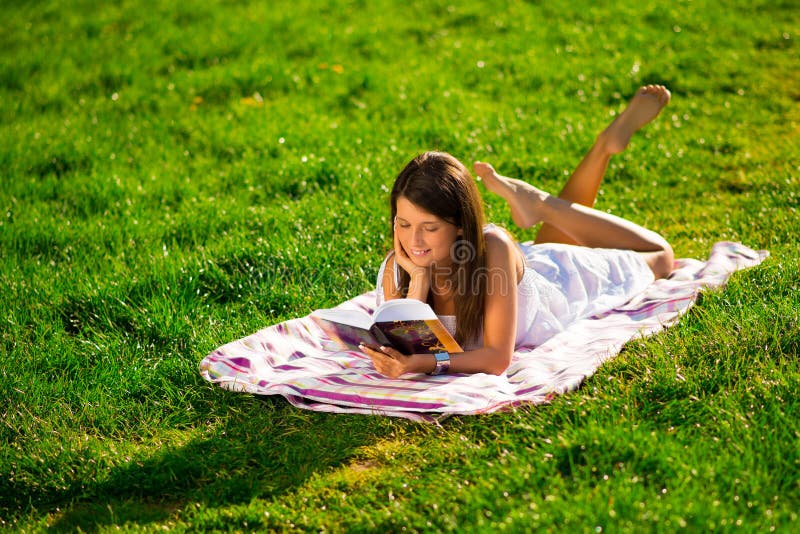 Reading a Book in the Spring Sun Stock Photo - Image of dress, park ...