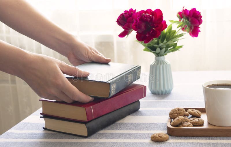 Reading a Book at a Table by the Window. Book in Hand,morning Coffee at ...