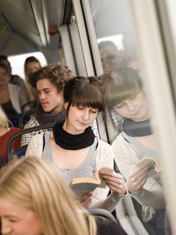 Reading at the bus stock photo. Image of book, communications - 22075590