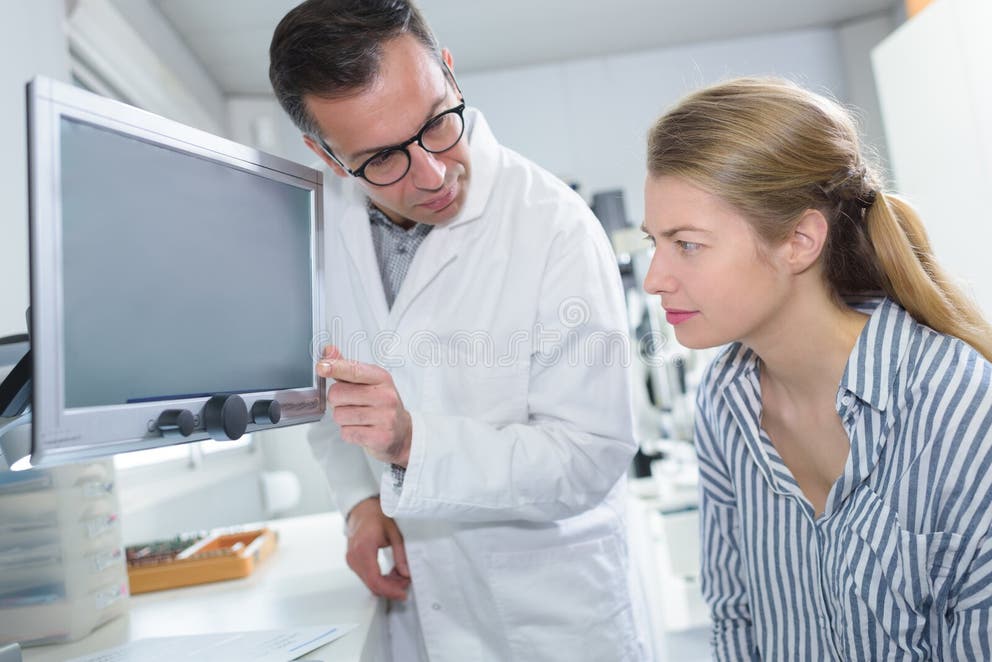 Reading from Computer Screen Stock Photo - Image of occupation, clinic ...