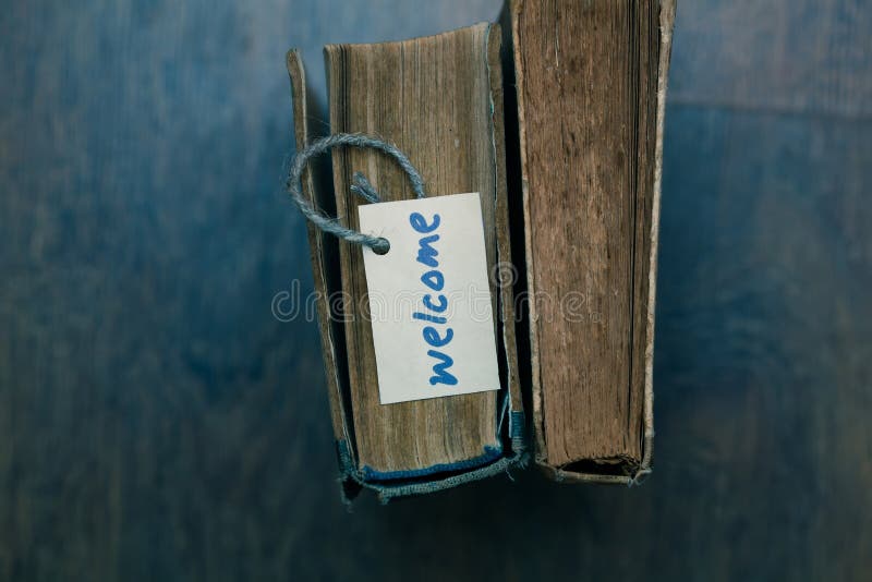 Reading Concept, Top Viewed Vintage Book with a Sign - Welcome Stock ...