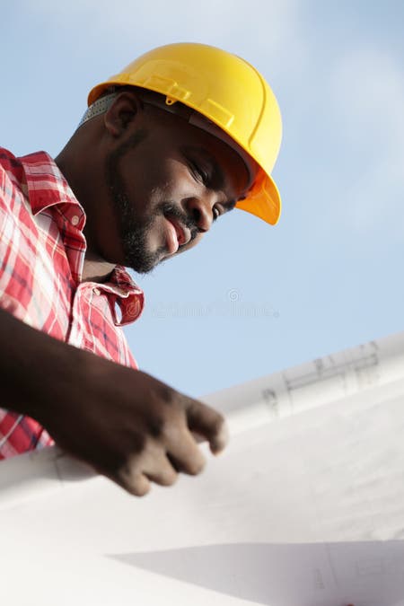 Reading construction plans stock image. Image of businessman - 15551131