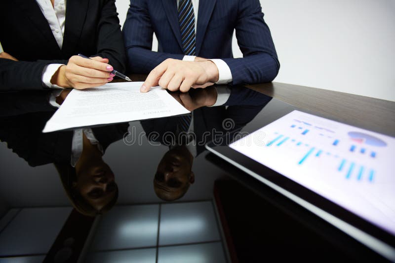Reading contract together stock image. Image of businesswoman - 35658073