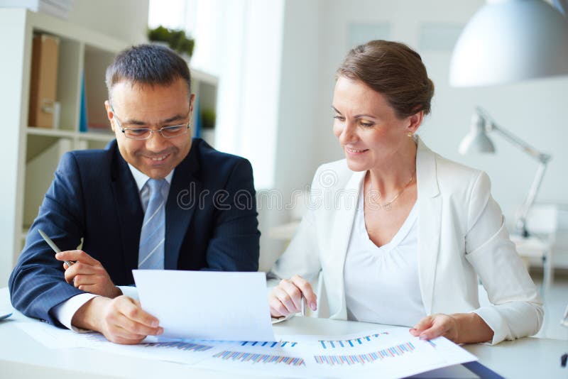 Reading contract together stock image. Image of businesswoman - 35658073