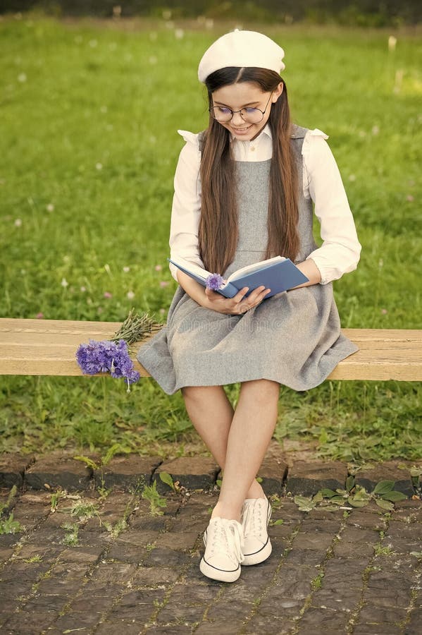 Reading Development. Little Child Read Book on Park Bench. Child ...