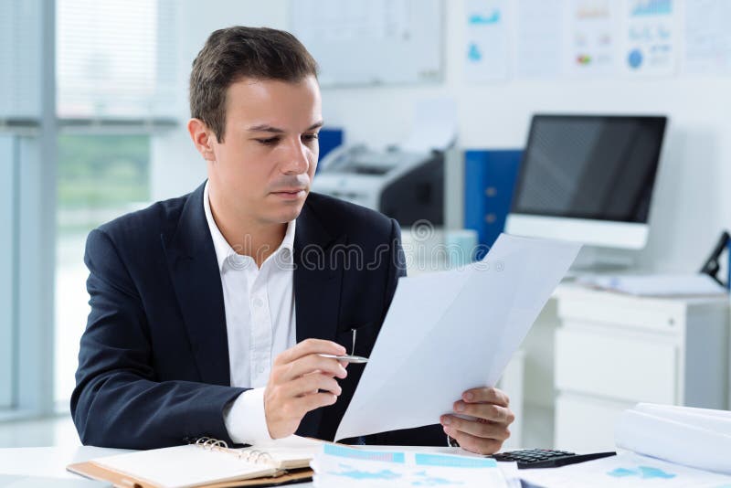 Reading a document stock photo. Image of serious, paperwork - 54390958