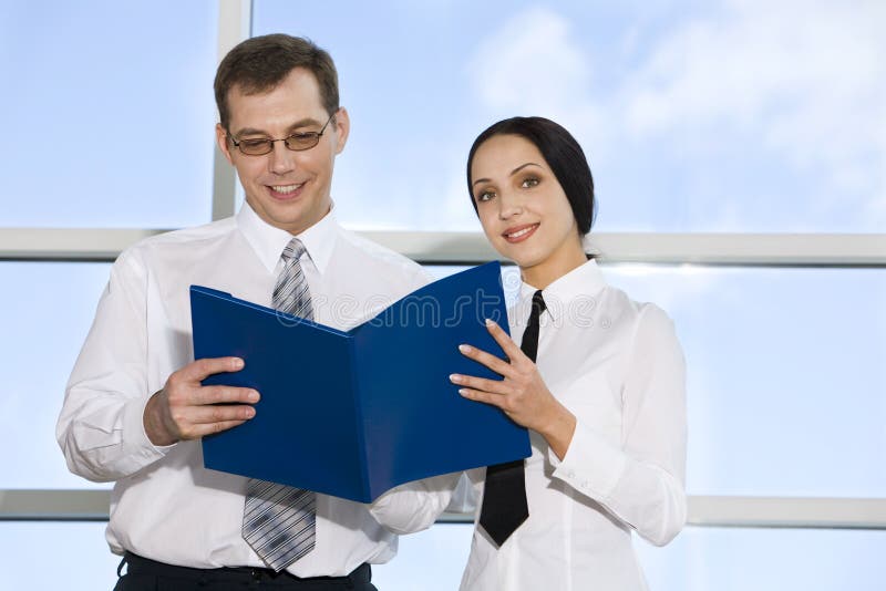 Reading documents stock photo. Image of building, partnership - 2471546