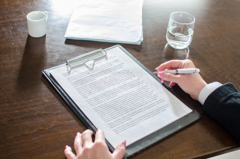 Businesswoman Reading a Document Stock Image - Image of adult, business ...