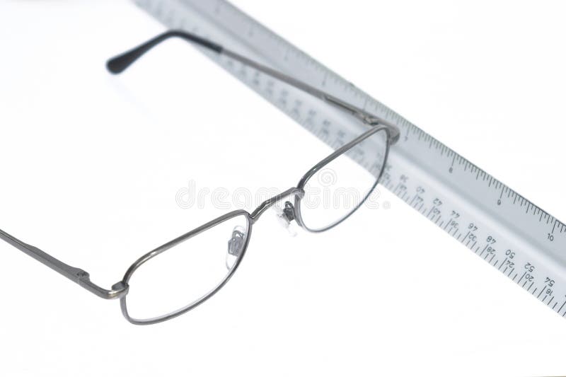 Reading Eyeglasses and Ruler on Table Stock Photo - Image of eyewear ...