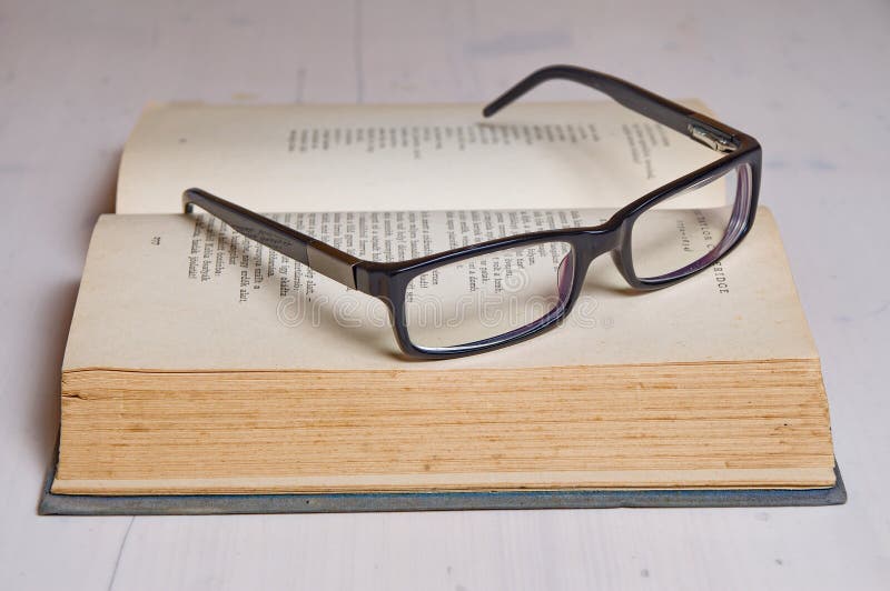 Reading glass on an book stock photo. Image of educational - 37696986