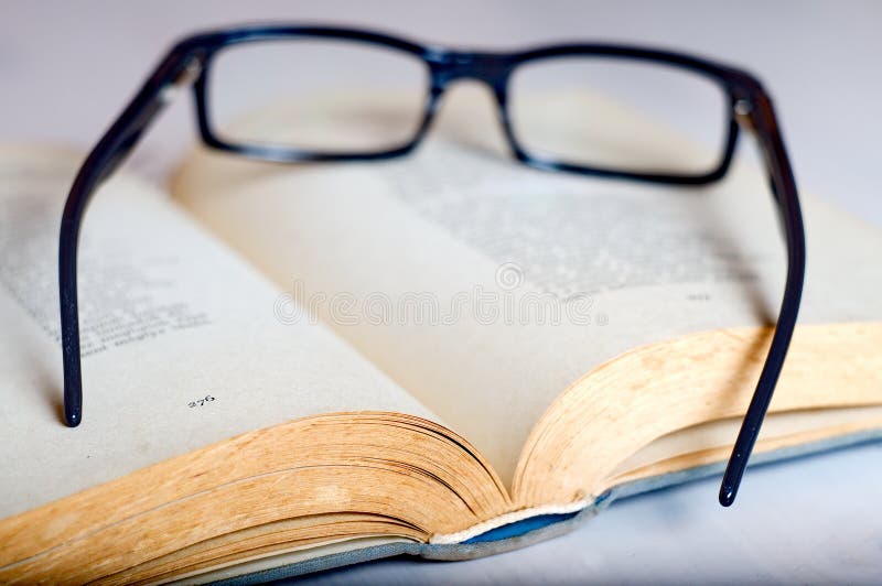Reading glass on an book stock photo. Image of educational - 37696986