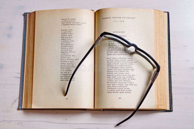 Reading glass on a book stock image. Image of glasses - 43750457