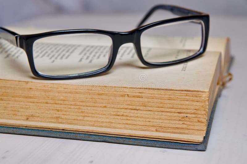Reading glass on an book stock photo. Image of educational - 37696986