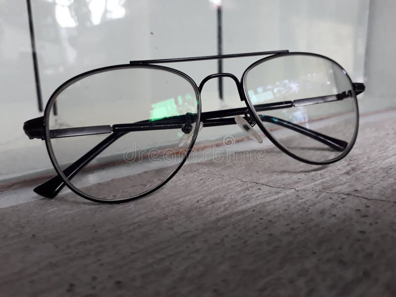 Reading Glasses with Black Frames in Front of a Glass Wall Stock Image ...