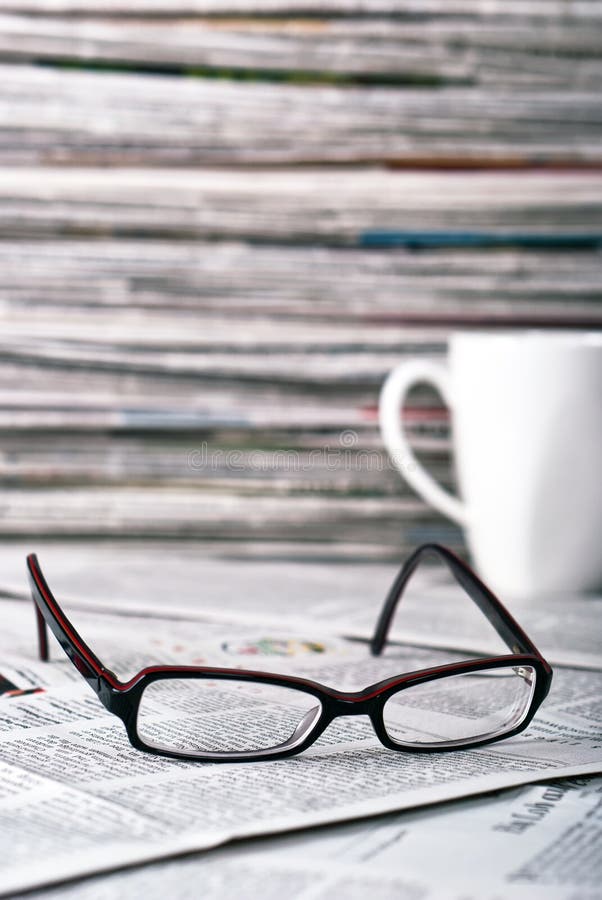 Reading Glasses and a Coffee Cup Stock Photo - Image of pile, drink ...