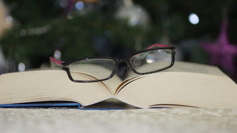 Reading Glasses on an Open Book Stock Image - Image of colorful, black ...