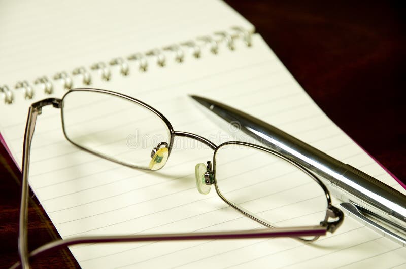 Reading Glasses and Pen on Notebook Stock Image - Image of list, empty ...