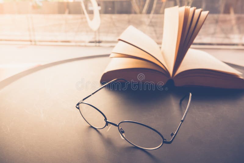 Reading Glasses on Table with Open Book Stock Image - Image of ...