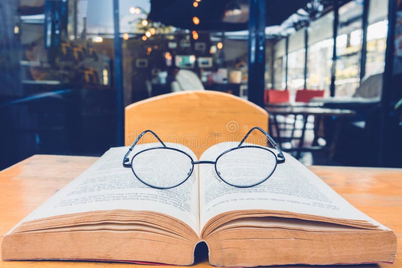 Reading Glasses on Table with Open Book Stock Image - Image of coffee ...