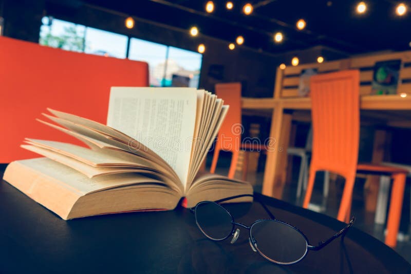 Reading Glasses on Table with Open Book Stock Image - Image of ...