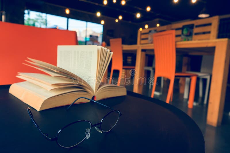 Reading Glasses on Table with Open Book Stock Photo - Image of table ...