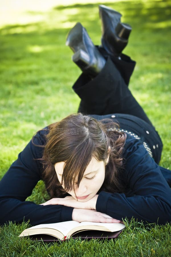 Reading on the grass stock photo. Image of elegant, laydown - 4549964