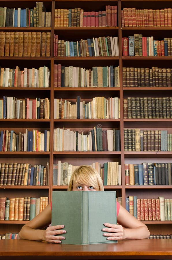 Reading and Hiding Behind a Book Stock Photo - Image of human, habits ...