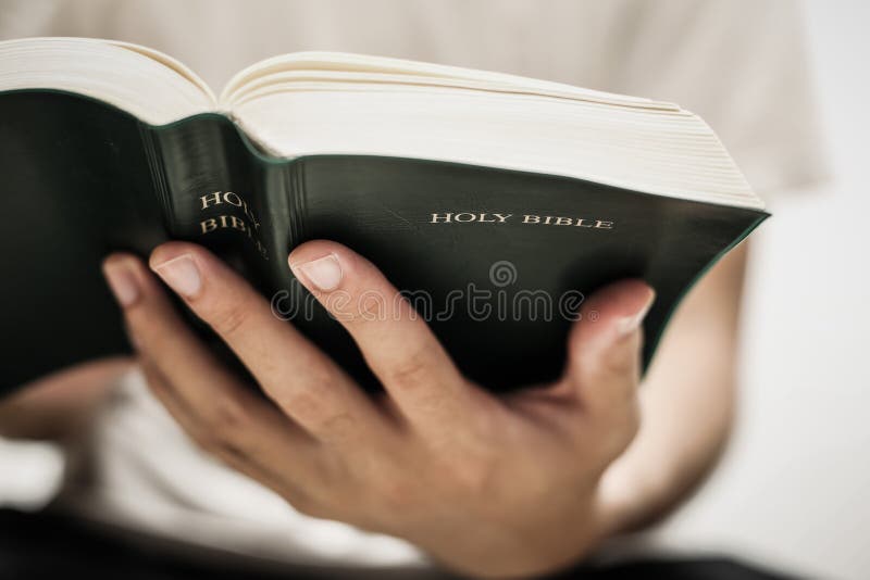 Reading Holy Bible stock image. Image of holding, read - 149443057