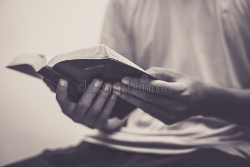 Reading Holy Bible stock image. Image of holding, read - 149443057
