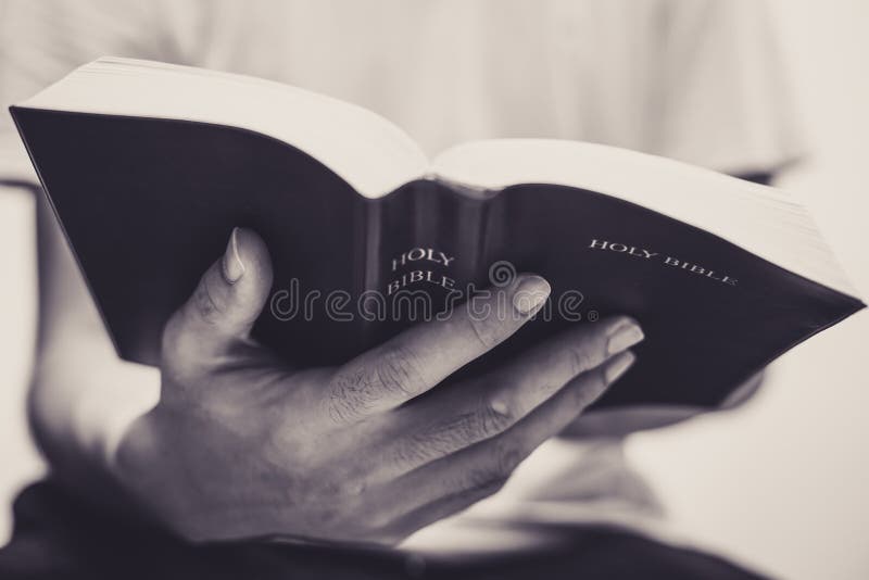 Reading Holy Bible stock image. Image of holding, read - 149443057