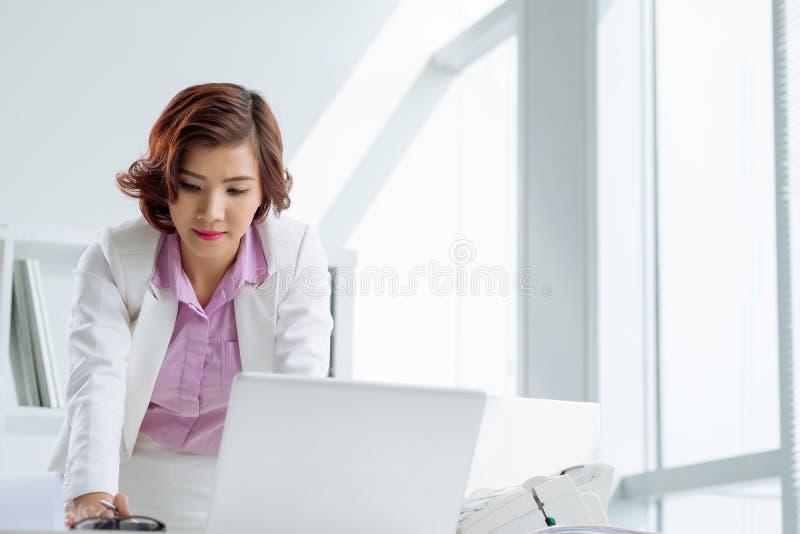 Reading Information on Laptop Stock Photo - Image of serious ...