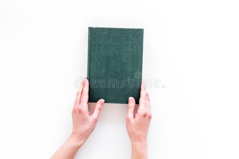 Reading for Leasure. Hands Take Hardback Book with Empty Cover on Blue ...