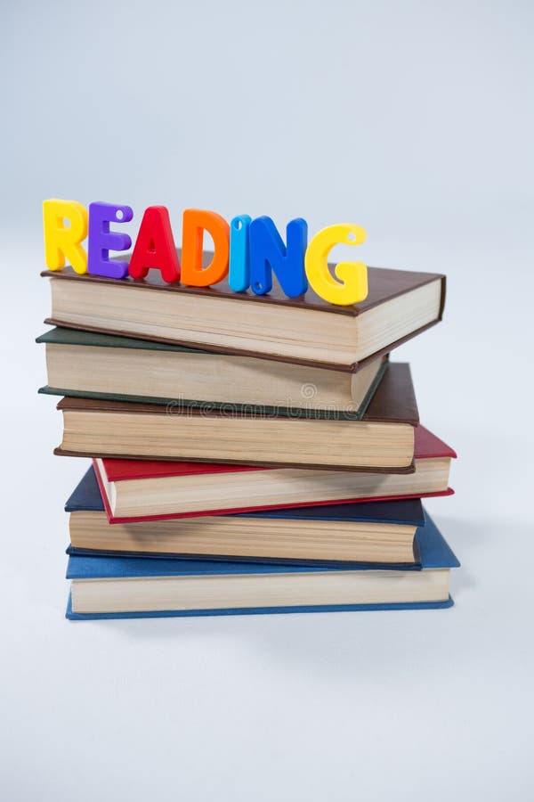 Reading Letter Blocks on Stack of Books Stock Image - Image of word ...