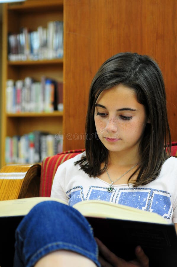 Reading in the Library stock photo. Image of schoolgirl - 13636784