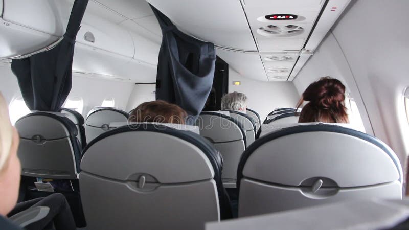 Reading Magazine Inside an Airplane during Flight Stock Footage - Video ...